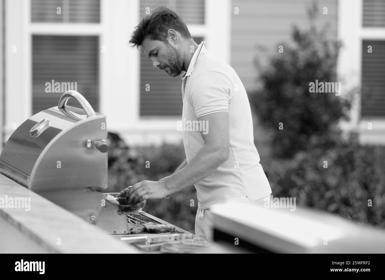 Grill cook. Chef with BBQ cooking tools. Barbecue and grill. Picnic and ...