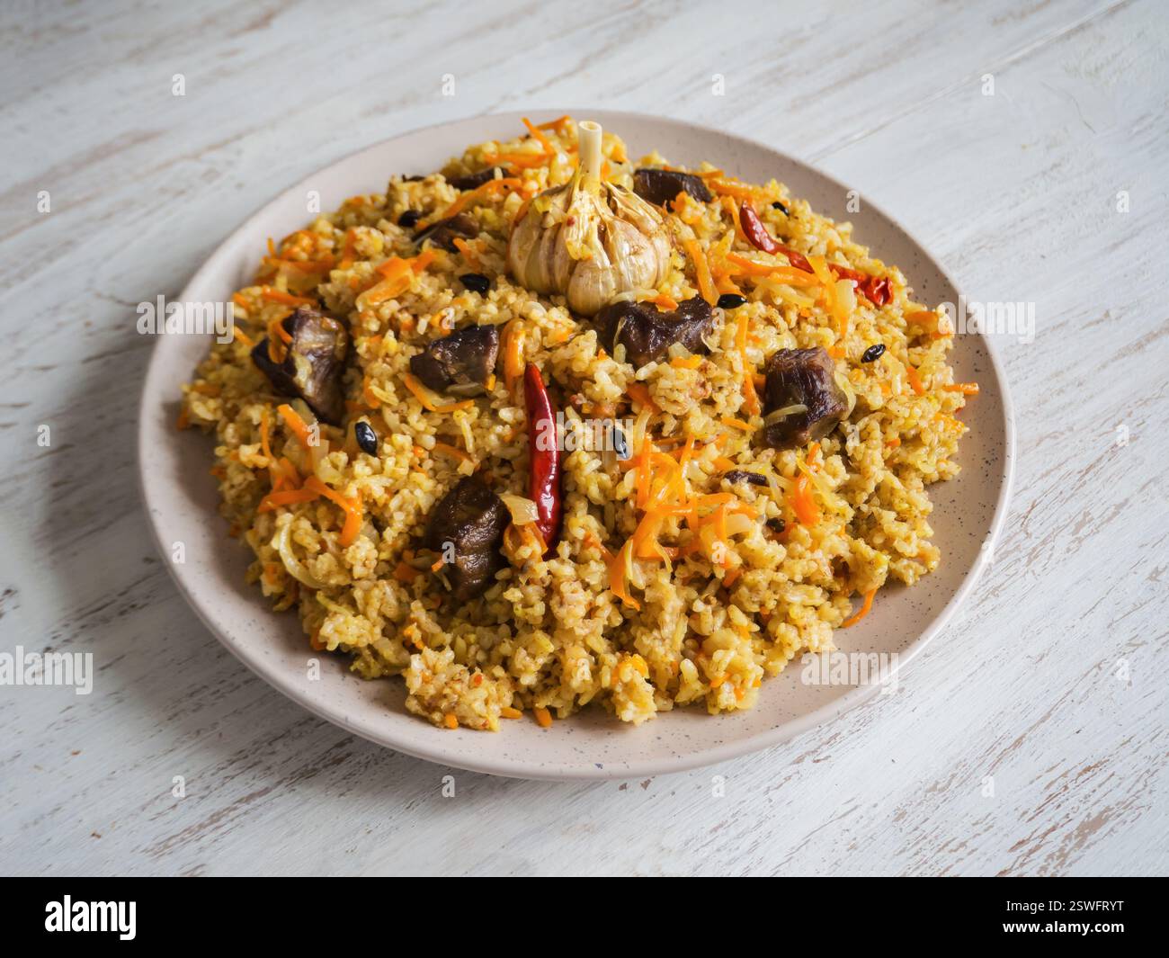 Meat Biryani in a plate on a black table Stock Photo - Alamy