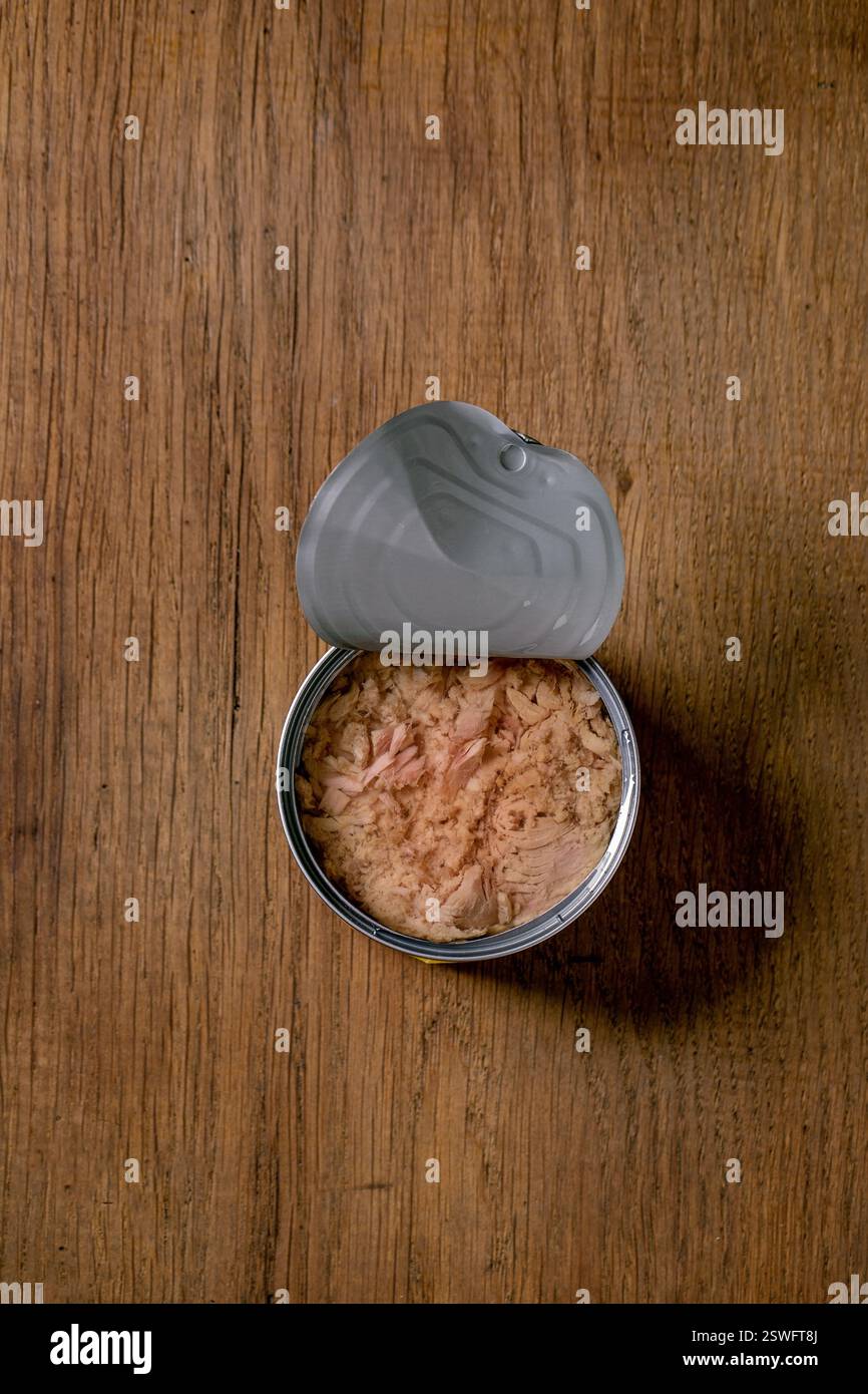 Canned tuna fish in can over wood Stock Photo - Alamy