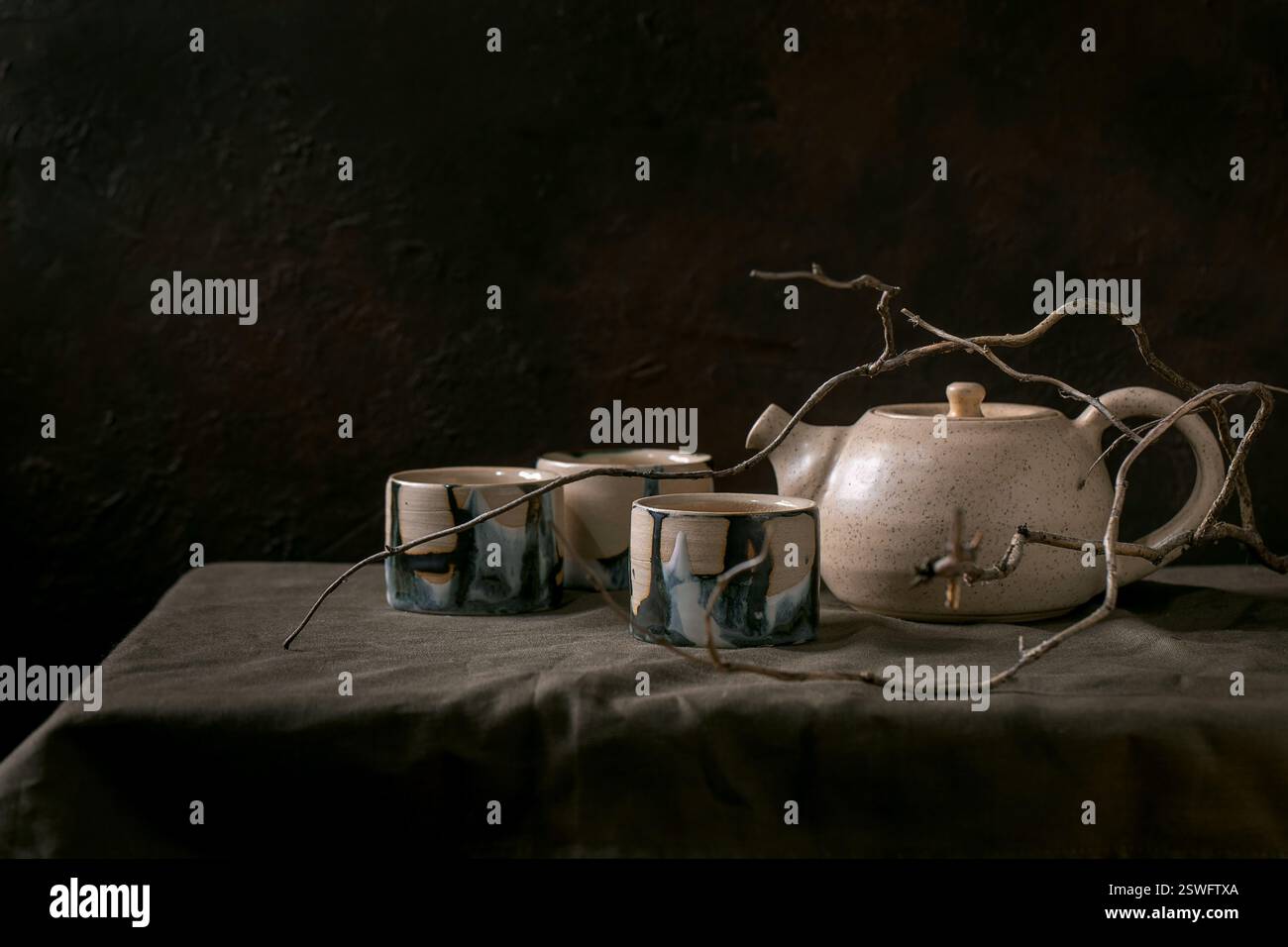Craft handmade ceramic teapots with dark background Stock Photo - Alamy