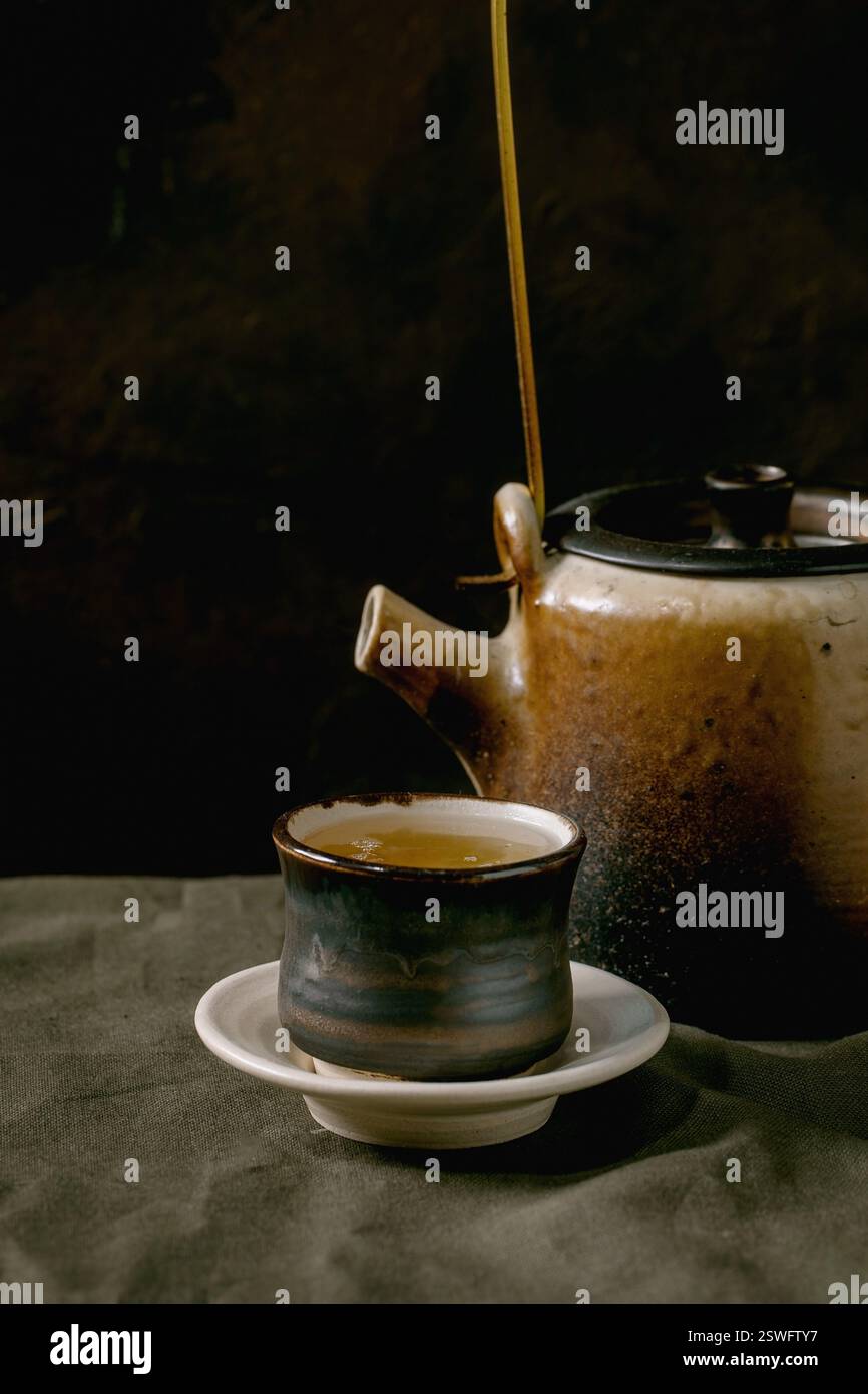 Craft handmade ceramic teapots with dark background Stock Photo - Alamy