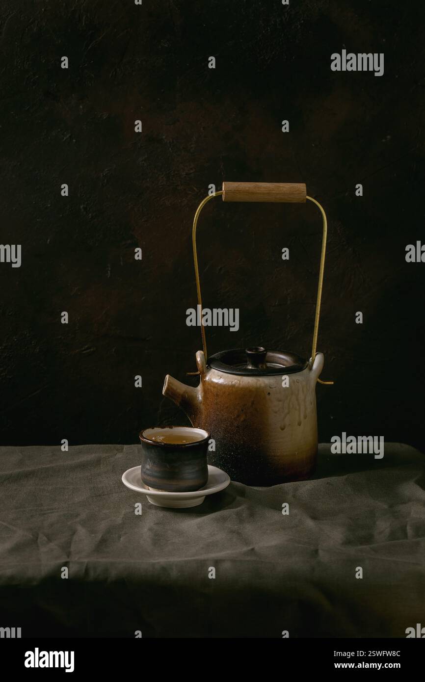 Craft handmade ceramic teapots with dark background Stock Photo - Alamy