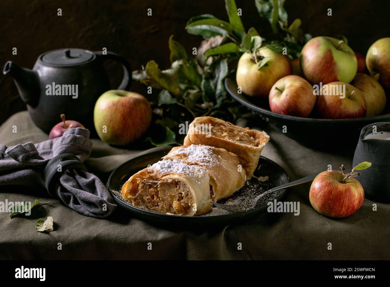 Homemade sliced traditional apple strudel pie and apples Stock Photo ...