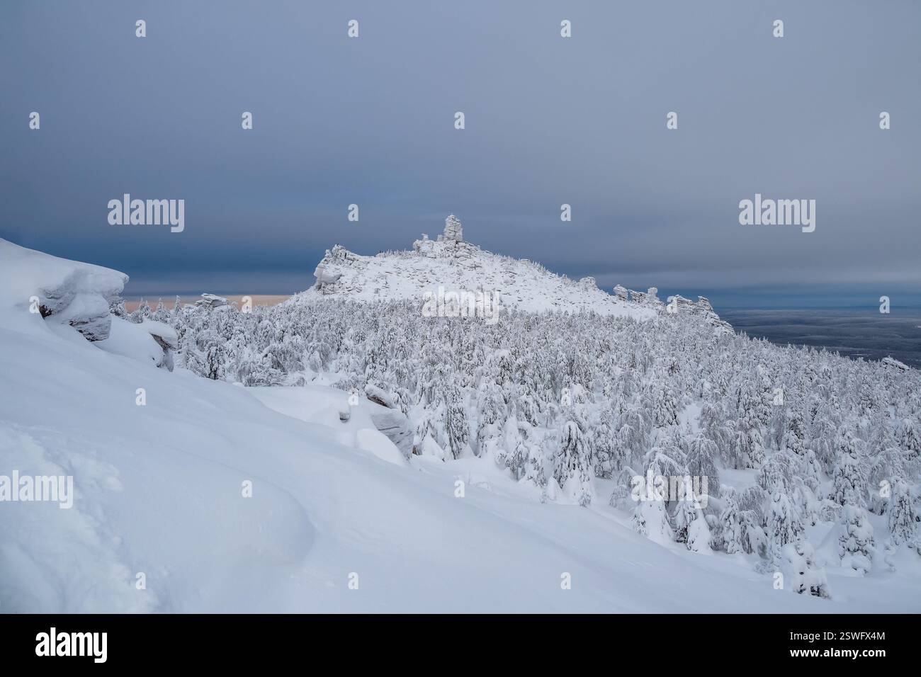 Stone pillars of weathering in winter. Landscape of plateau with snow ...