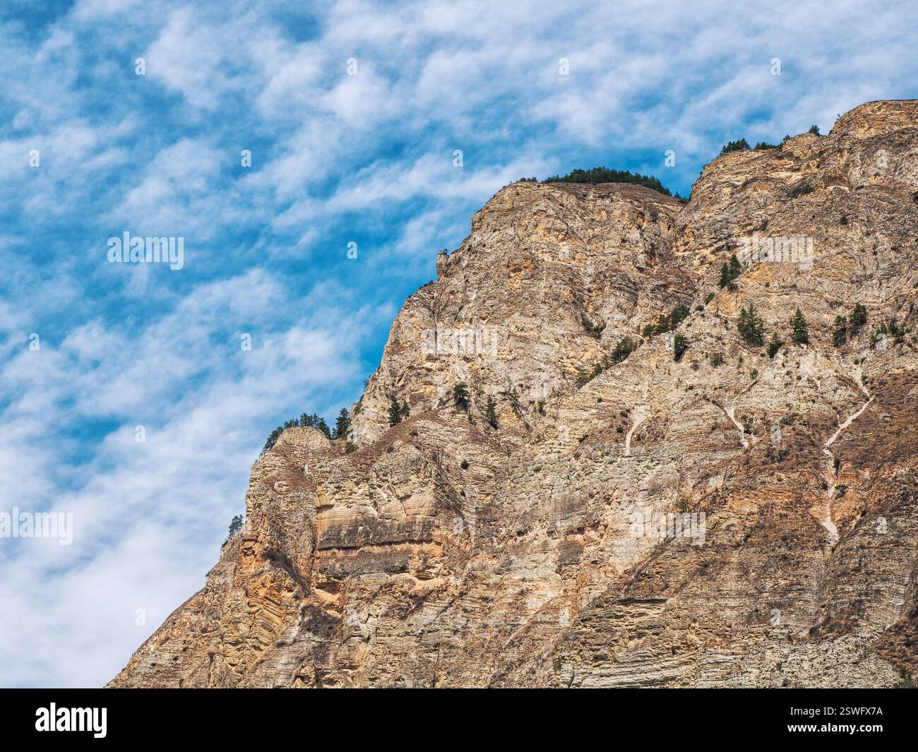 Big rock formation, different rock formations and soil layers. Distant ...