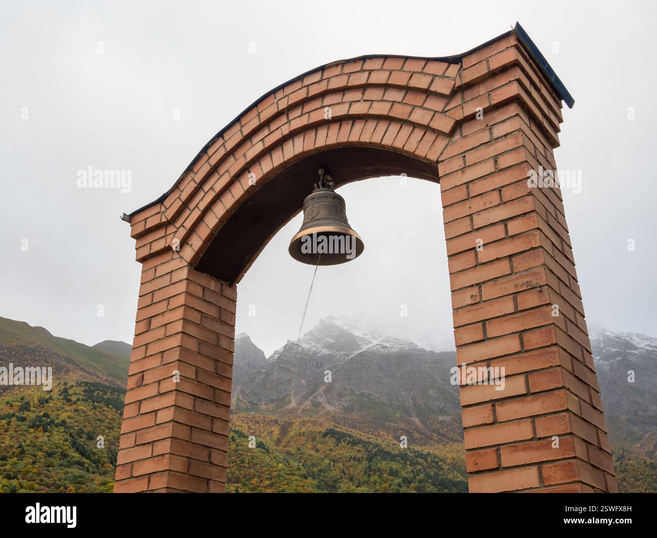 Stock photo of ancient copper or bronze bell hanging on a stone frame ...