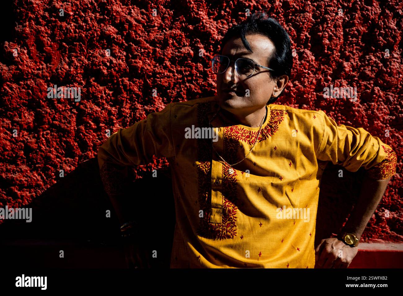 An indian man wearing an indian traditional bengali red dhoti and ...