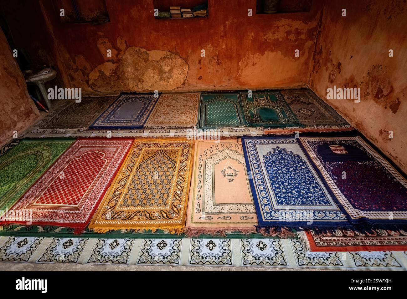 Muslim prayer carpets of various colors near the mosque in Dhaka ...