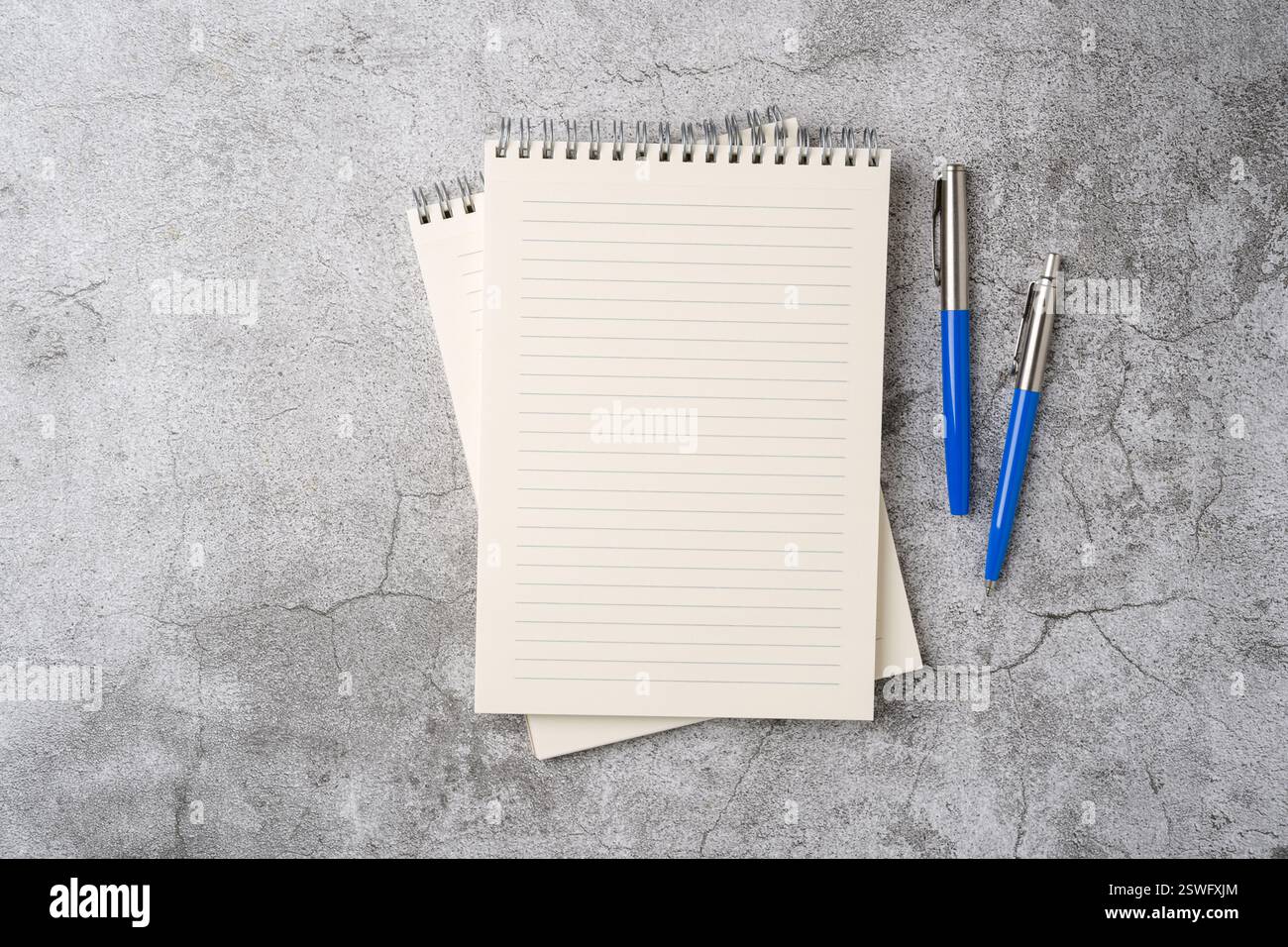 Top view of notebook and ballpoint pen on stone background Stock Photo ...