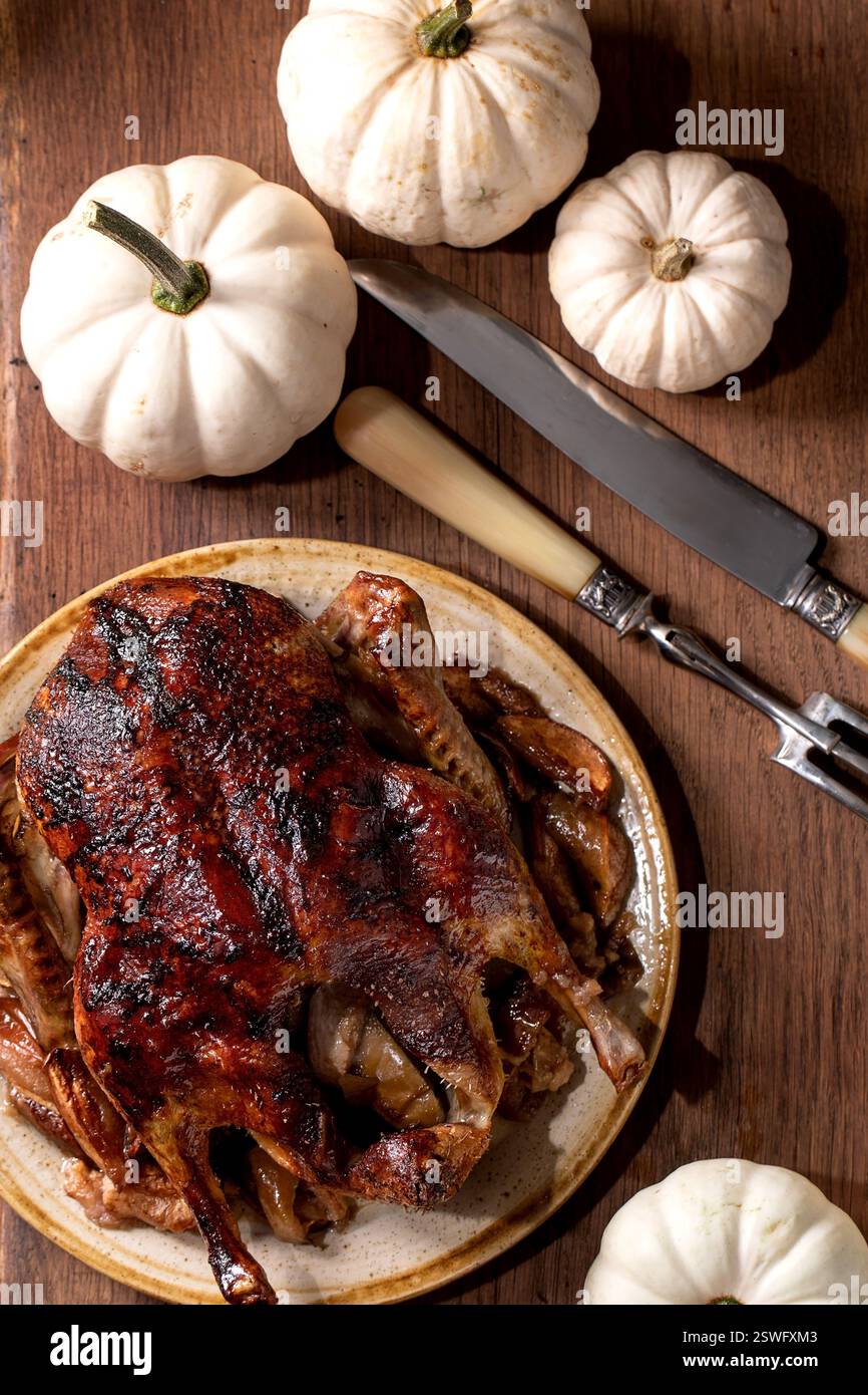 Classic dish roasted glazed duck with apples Stock Photo - Alamy