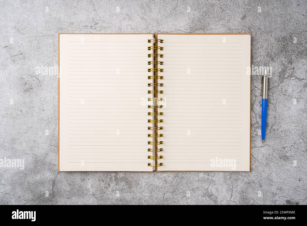Top view of notebook and ballpoint pen on stone background Stock Photo ...