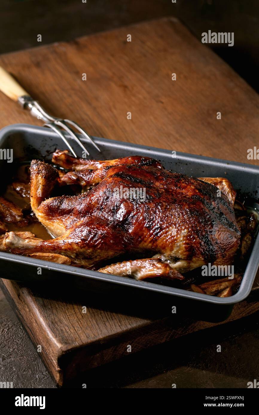 Classic dish roasted glazed duck with apples Stock Photo - Alamy
