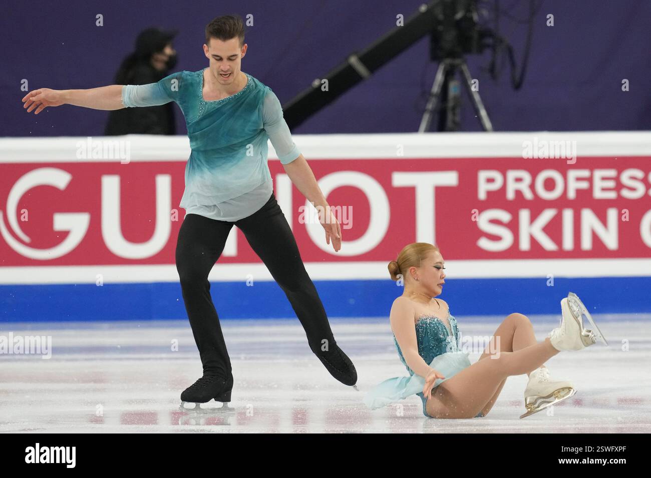 United States' Audrey Shin, right, falls during a performance with ...