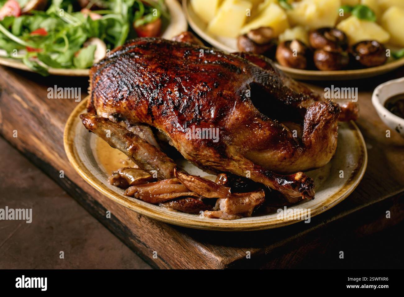 Classic dish roasted glazed duck with apples and garnish Stock Photo ...