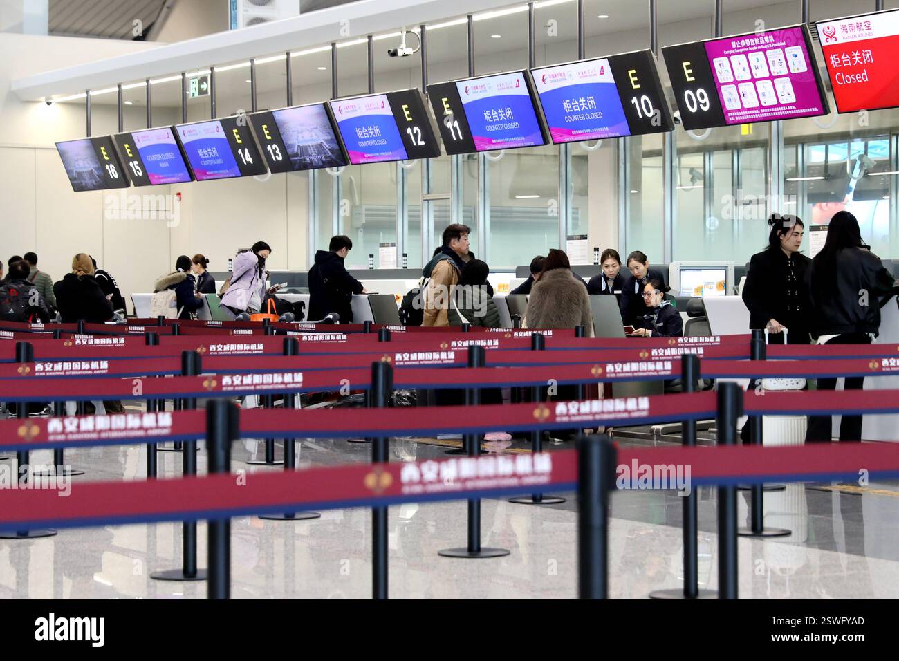 Xi'an,China.20th February 2025. Passengers check in at Terminal 5 of Xianyang International ...