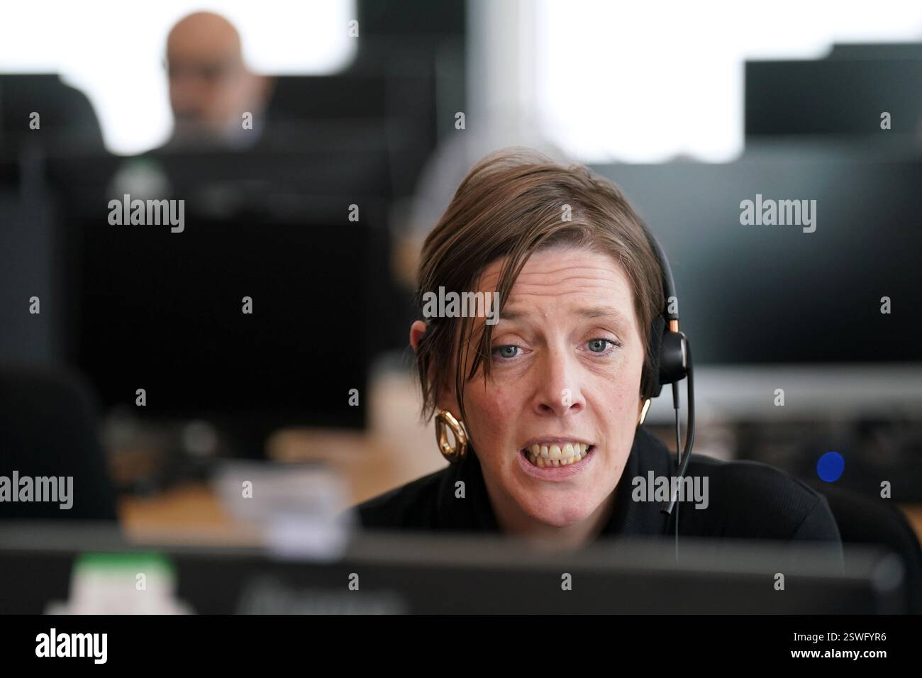 Safeguarding Minister Jess Phillips listens to an emergency call during ...