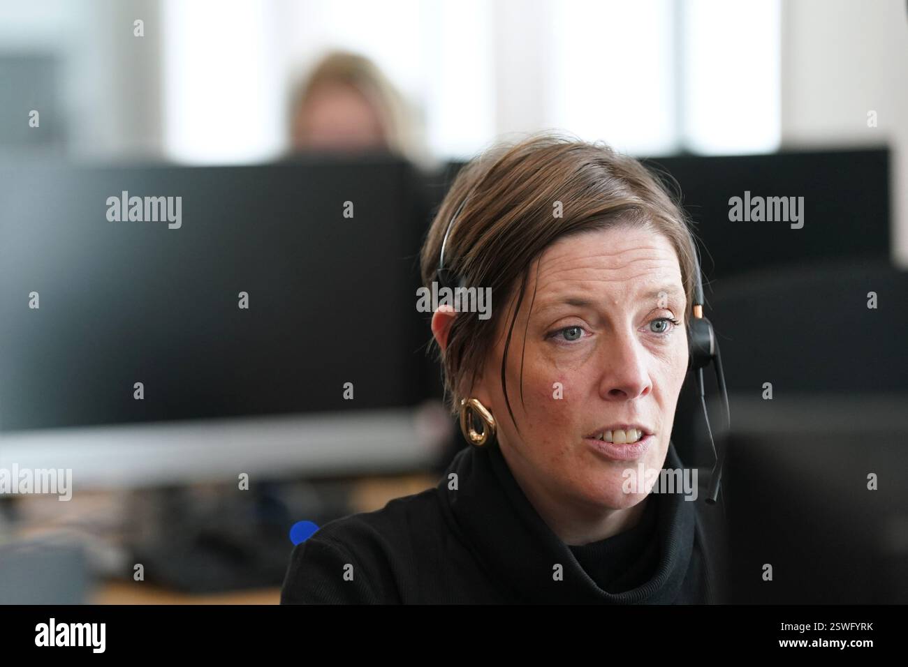 Safeguarding Minister Jess Phillips listens to an emergency call during ...