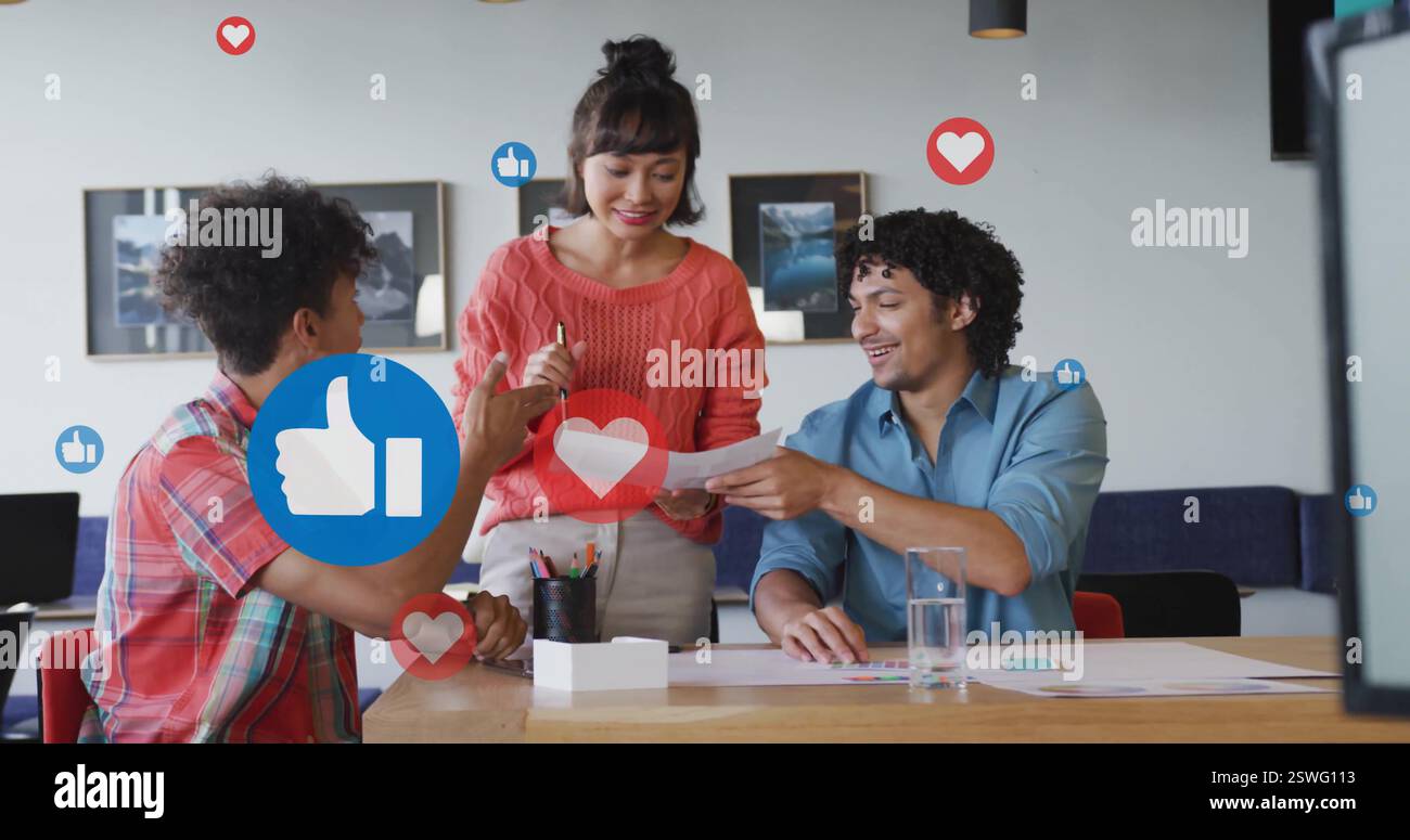 Image of media icons over diverse colleagues discussing work in office ...