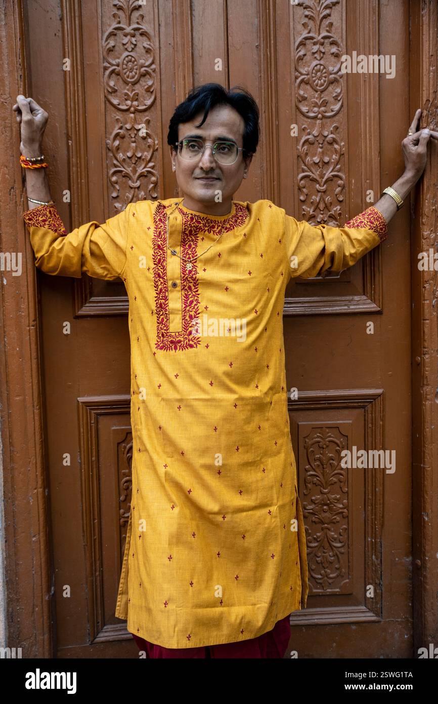 An indian man wearing an indian traditional bengali red dhoti and ...