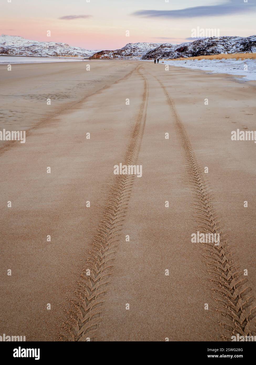 Tire tread mark on the sea sand extending into the distance Stock Photo ...