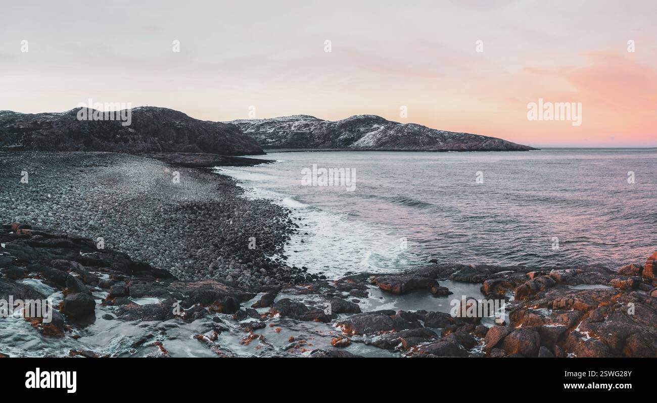 A rock cliff with a tidal shoreline. Wonderful panoramic mountain ...
