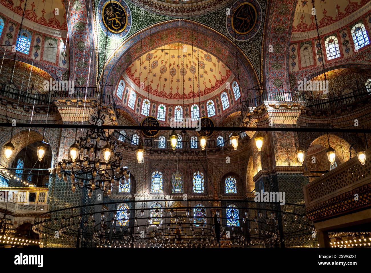 Interior view of a grand mosque featuring intricate tile work, large ...