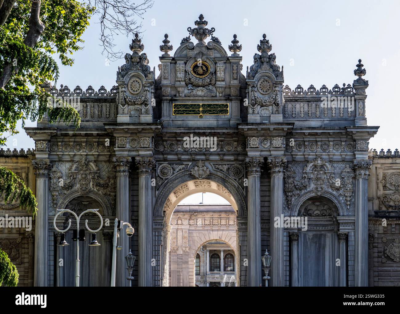 A grand architectural entrance featuring ornate stonework and intricate ...