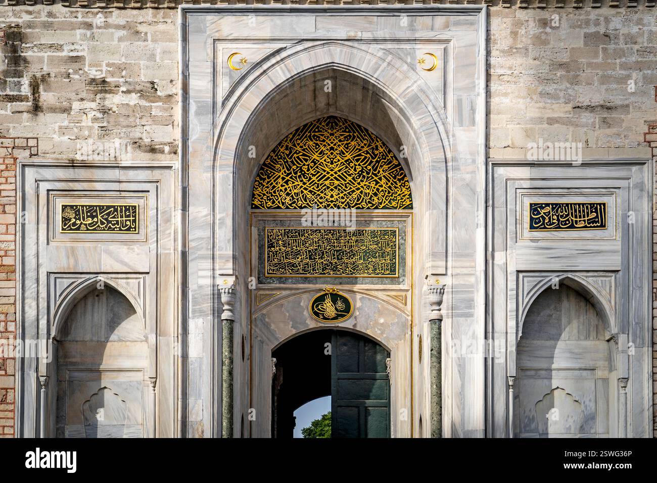A grand entrance featuring intricate marble architecture and ornate ...