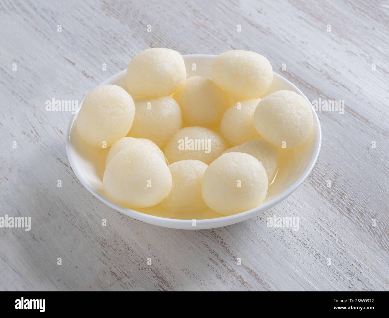 Indian Rasgulla dessert. Sweet served in a bowl, top view Stock Photo ...