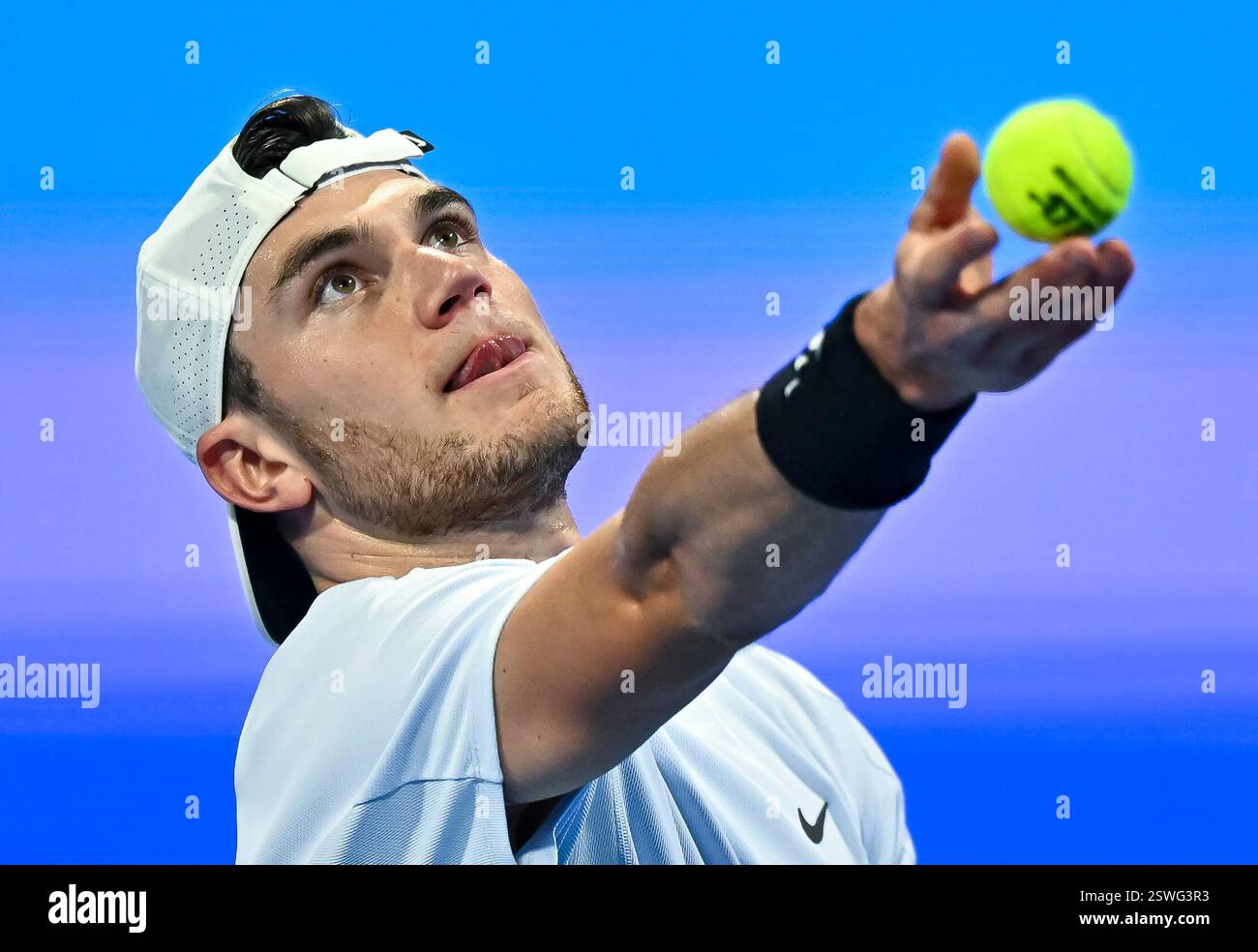 Doha, Qatar. 20th Feb, 2025. Jack Draper of Britain serves during the men's singles quarterfinal ...