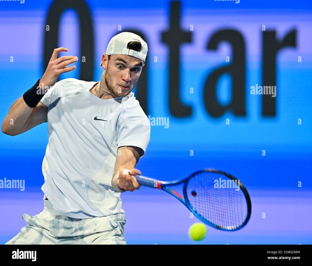 Doha, Qatar. 20th Feb, 2025. Jack Draper of Britain hits a return ...