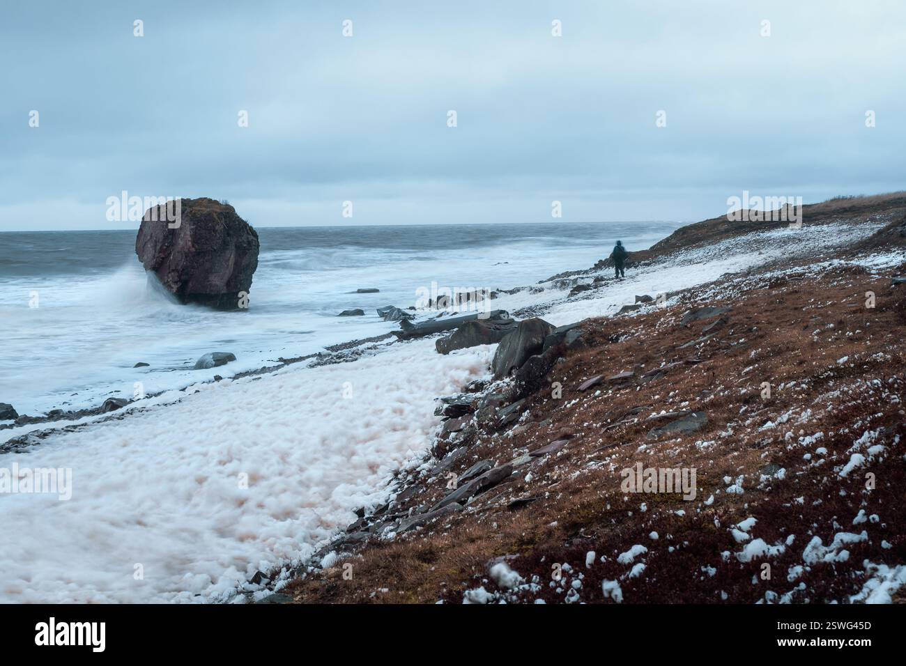 Figure of a man with a backpack in a blur in a strong wind in a storm ...