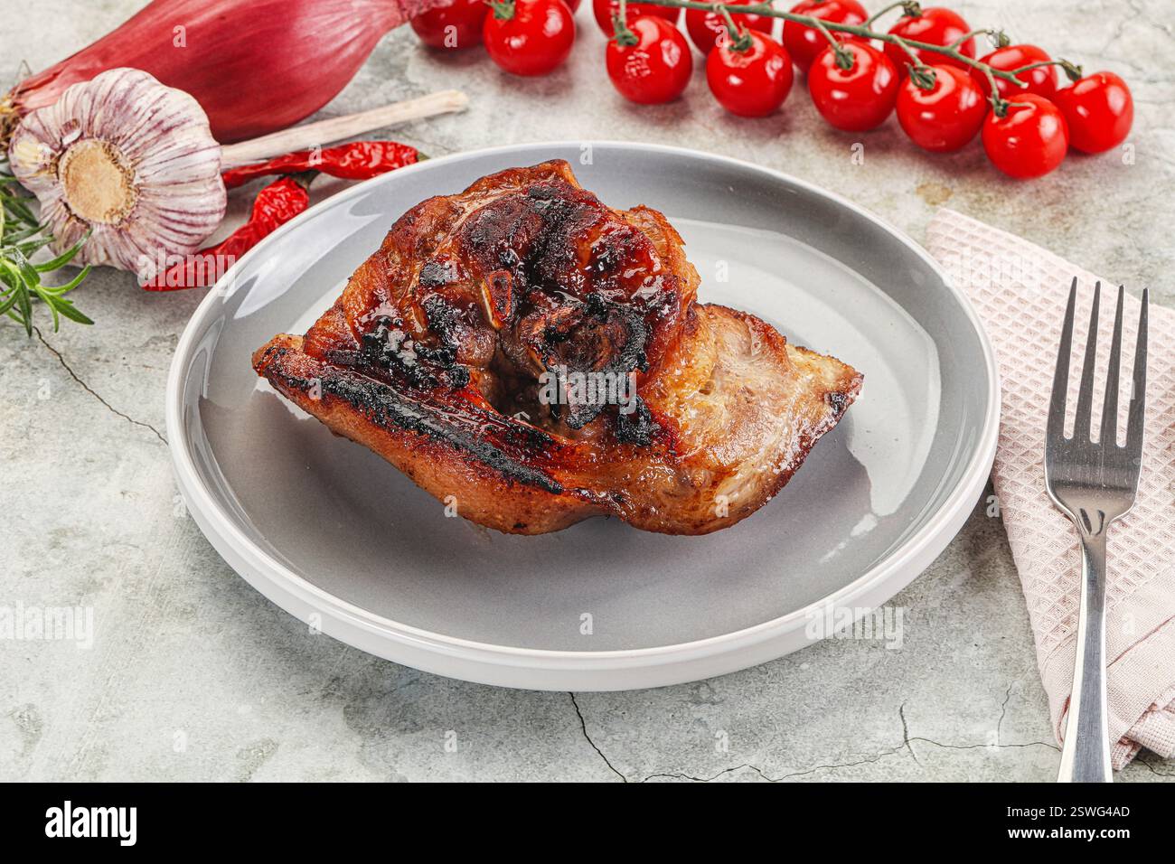 Roasted pork knuckle steak with bone Stock Photo - Alamy