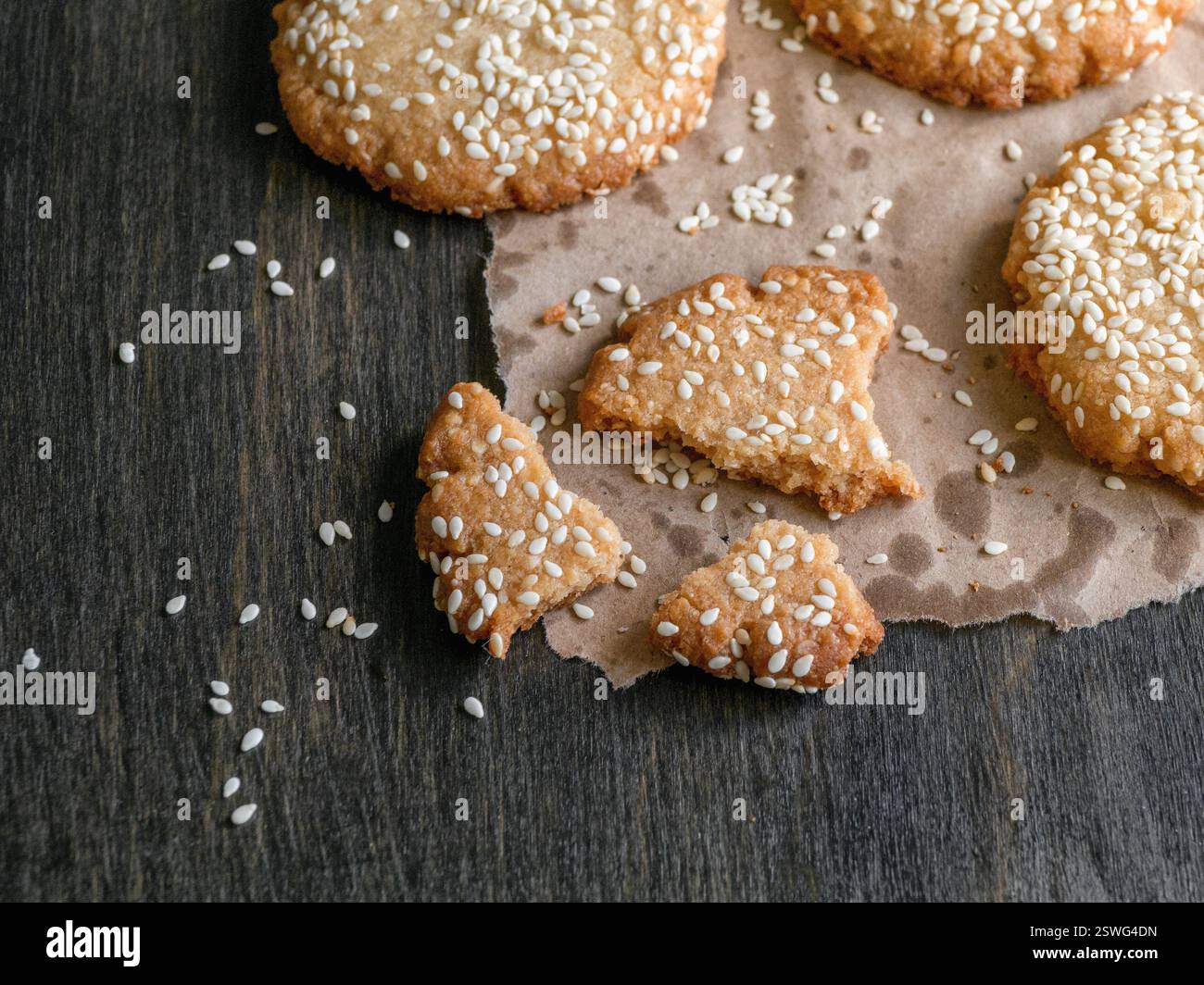 Homemade Vegan Tahini cookies are laid out on a dark table Stock Photo ...