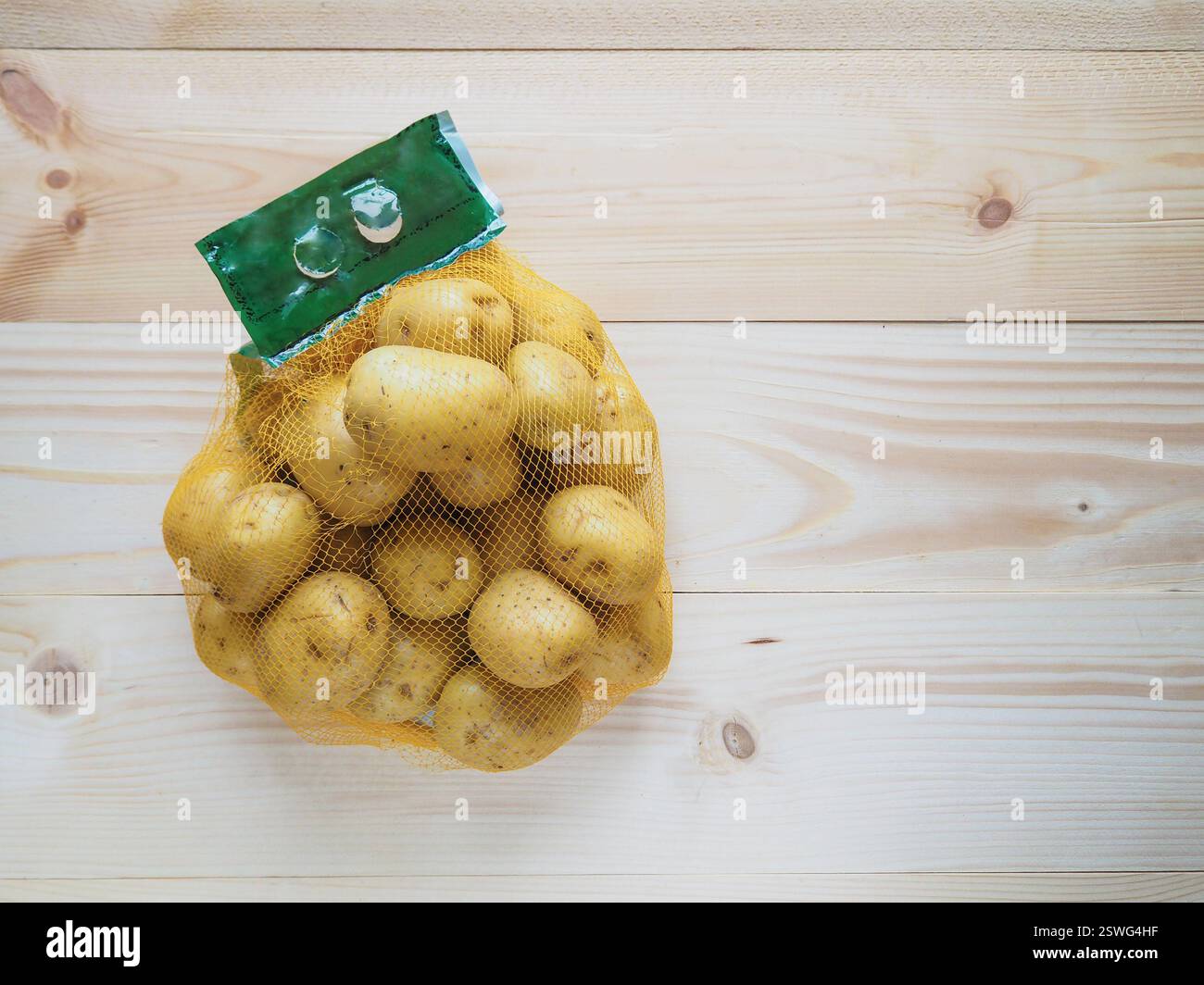 White potato tubers are packed in a grid on a shopping counter Stock ...