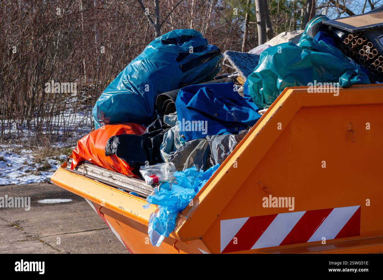 orange container with garbage Waste separation at the recycling center ...