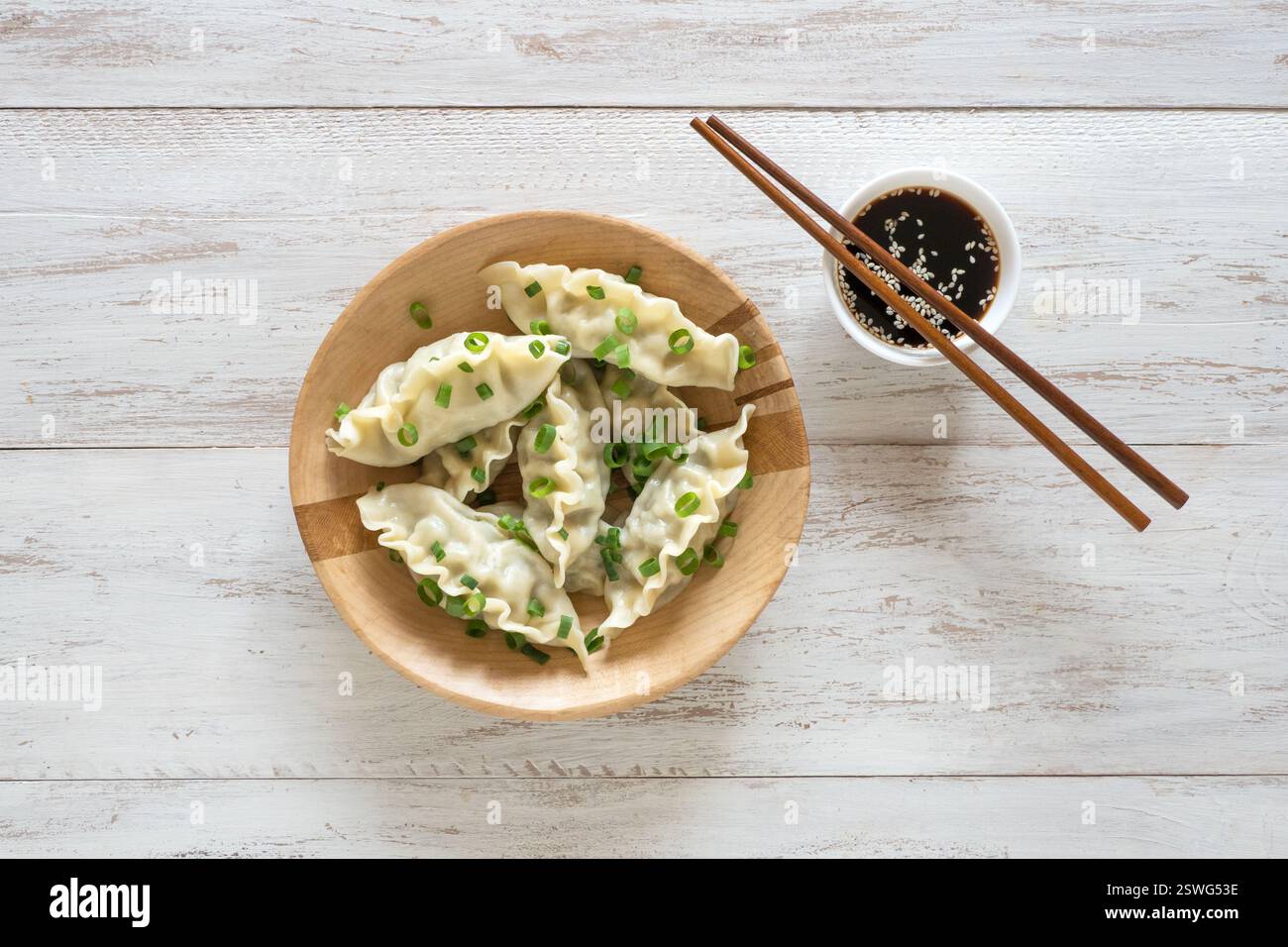 Asian dumplings. Fresh boiled gyoza dumplings with hot steams on wooden ...