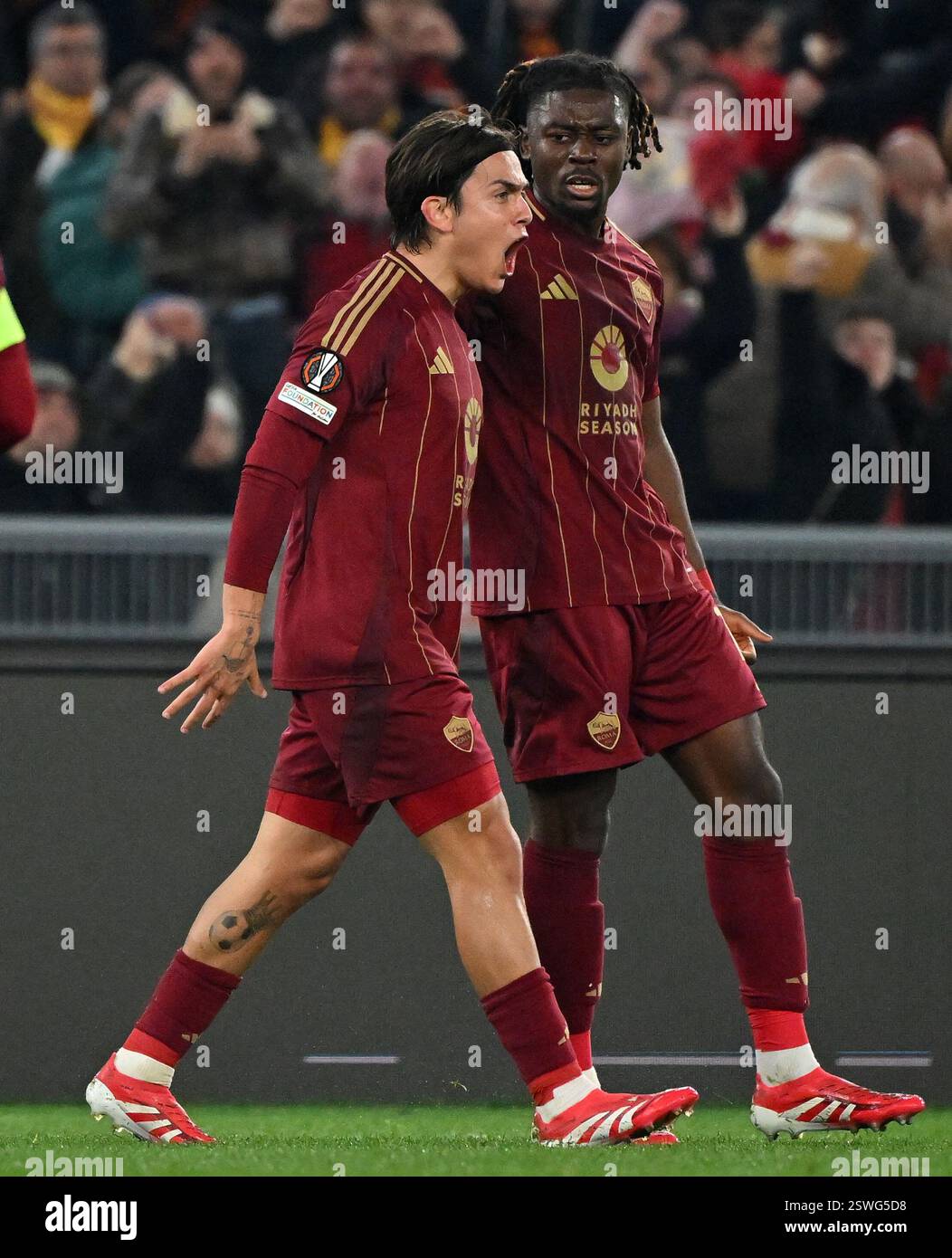 Rome. 20th Feb, 2025. Paulo Dybala (L) of Roma celebrates his first ...