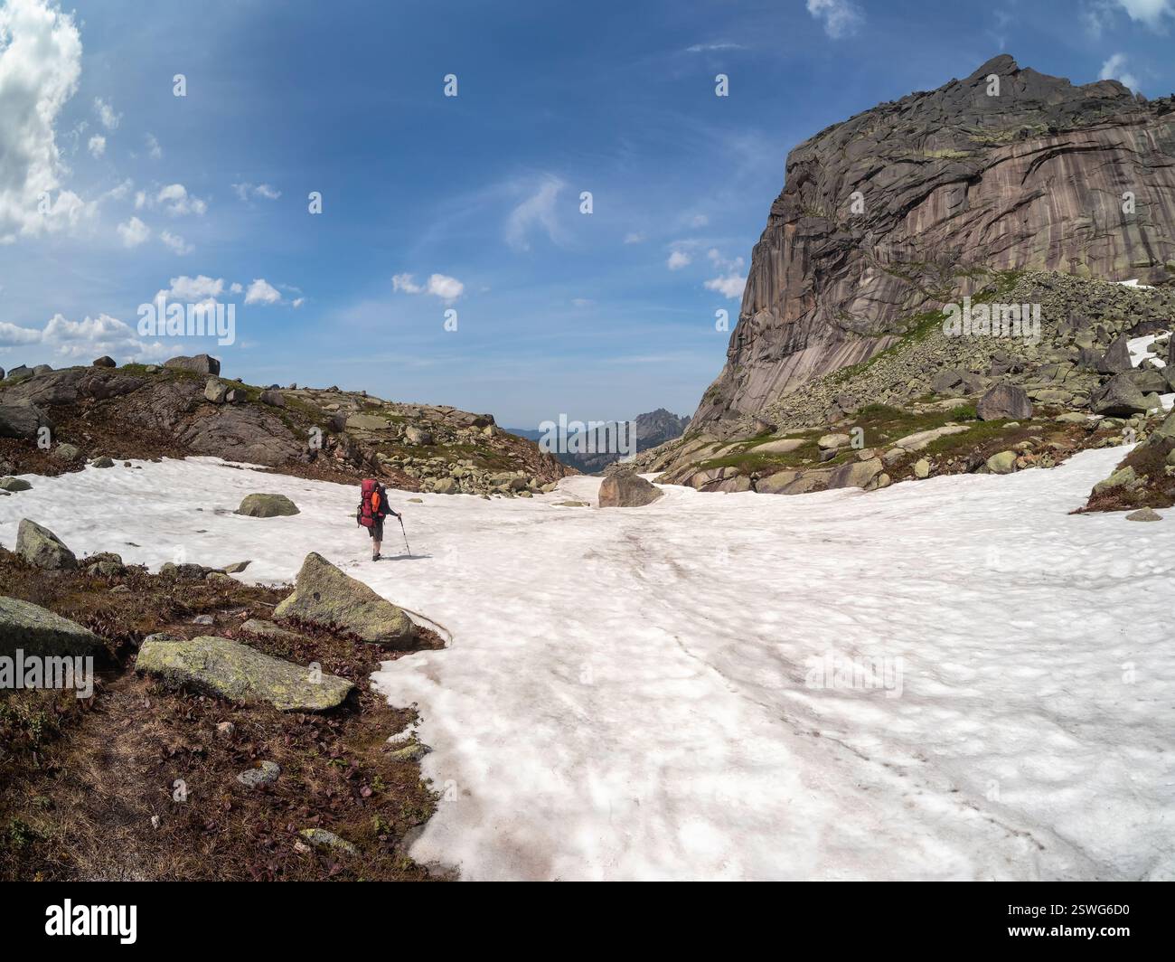 Tourist in walks on snow mountain near abyss edge on high altitude ...