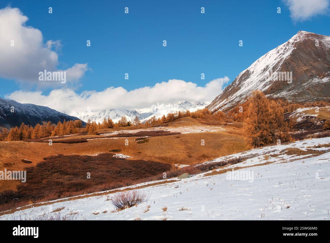 The transition of autumn into winter, a mountain snow-covered landscape ...
