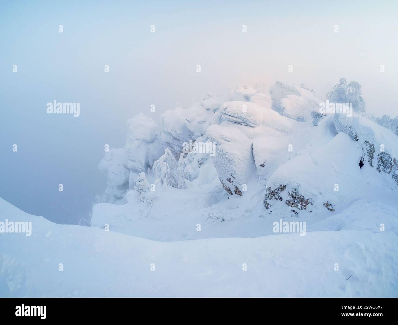 Beautiful snowy and rocky mountain landscape with frozen fog Stock ...