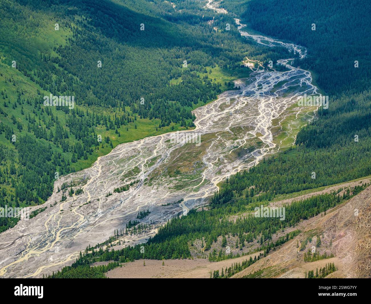 Glaciers melt, water flows into the valley. Picturesque highland green ...