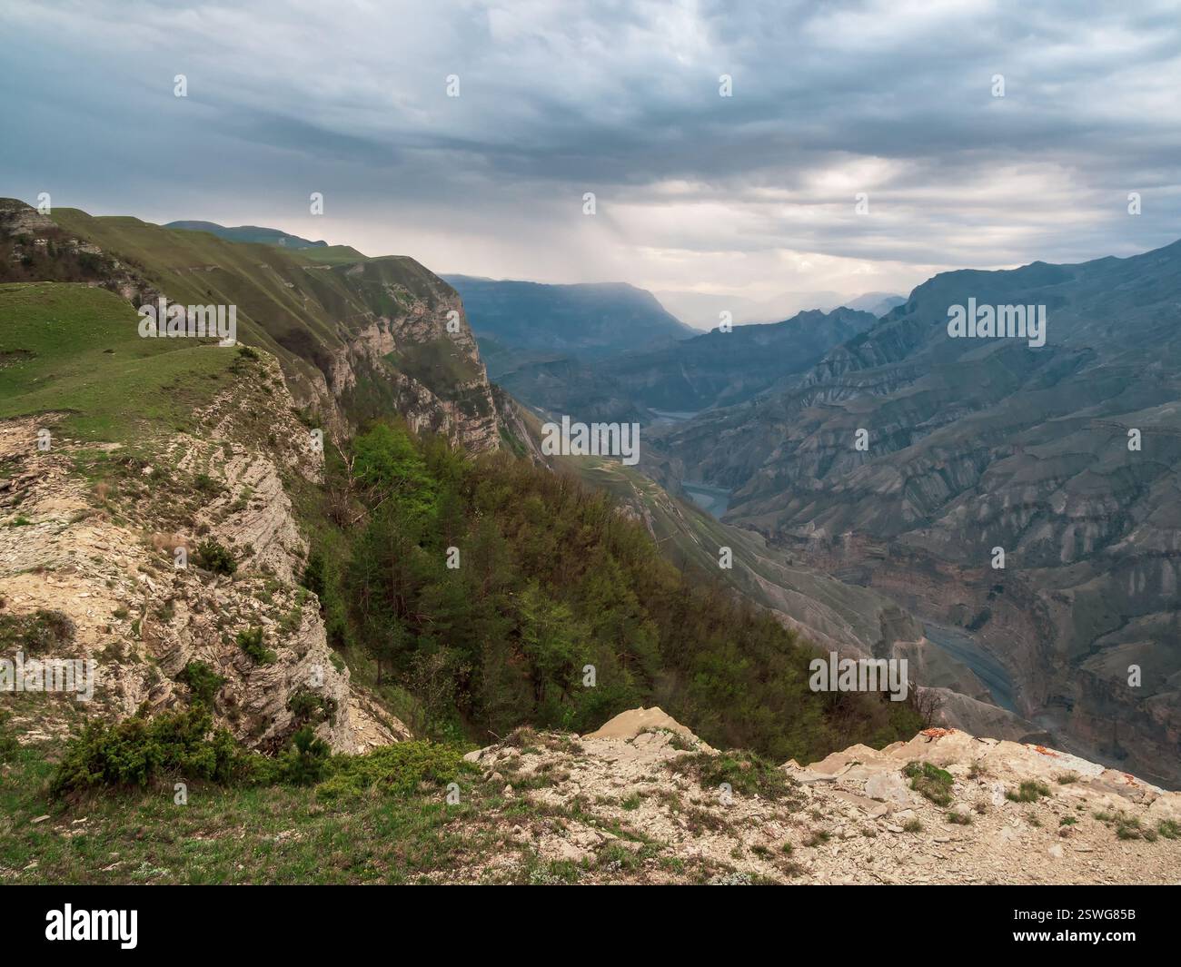 Colorful rainy landscape with cliff and big rocky mountains and epic ...