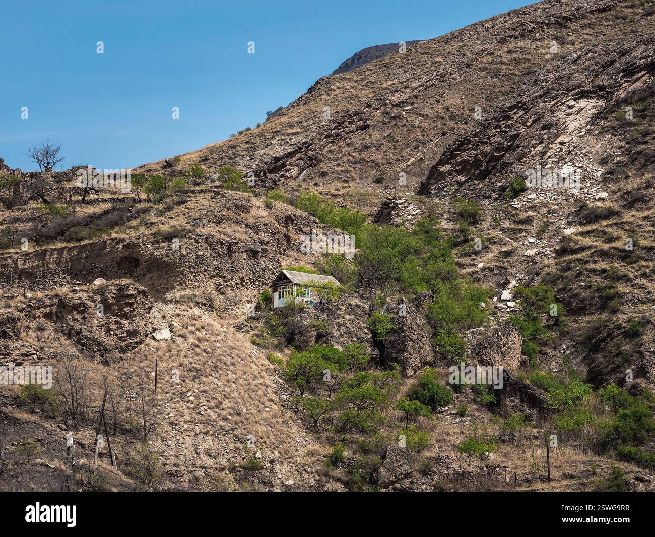 Ethnic house with garden at the edge of the abyss on a mountain peak at ...