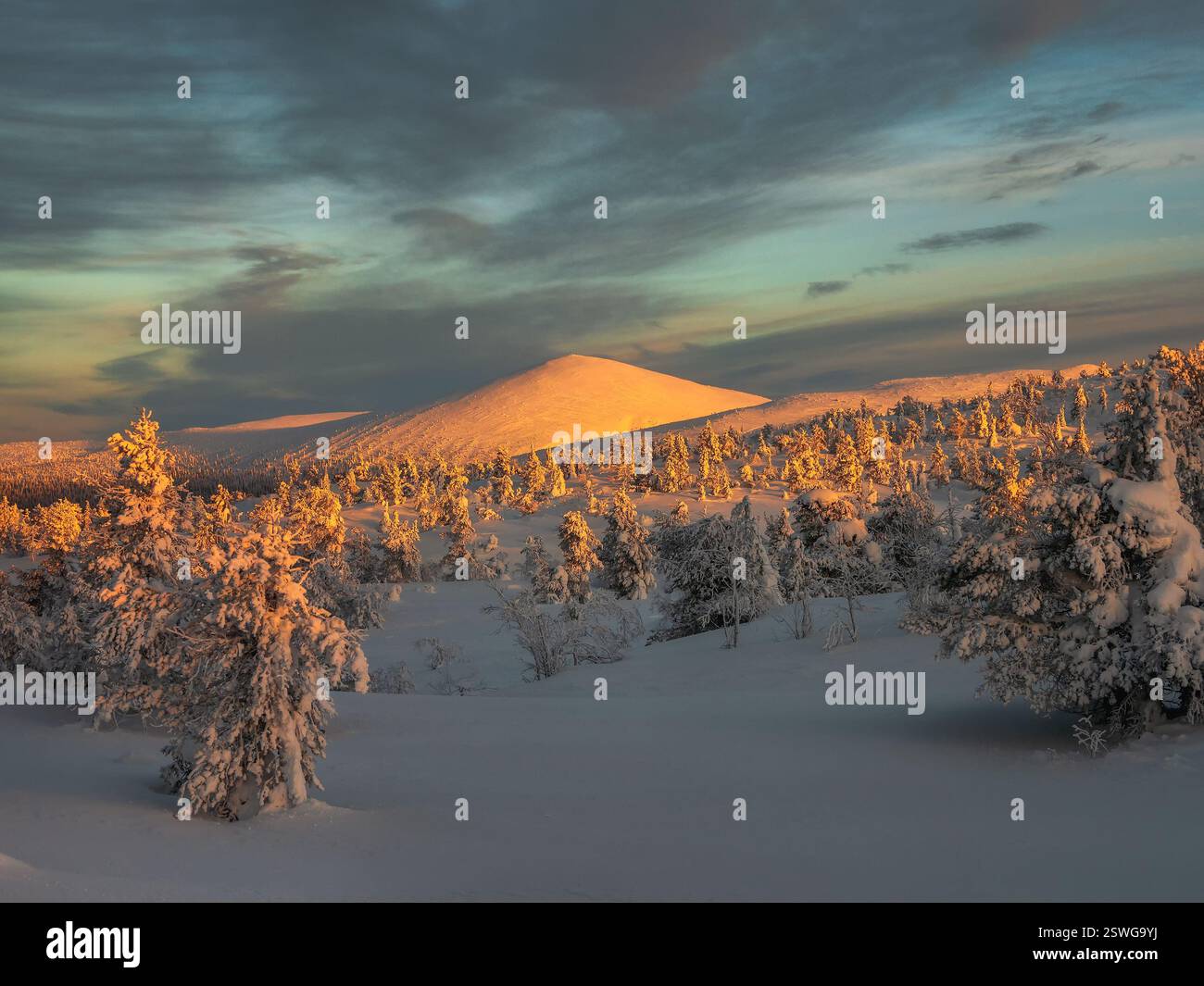 Copper hill. Beautiful sunny polar mountain with dark evening sky ...