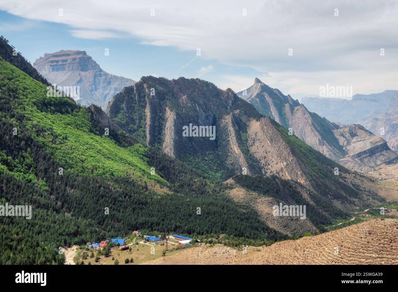 Sharp rocks. Colorful sunny green landscape with silhouettes of big ...