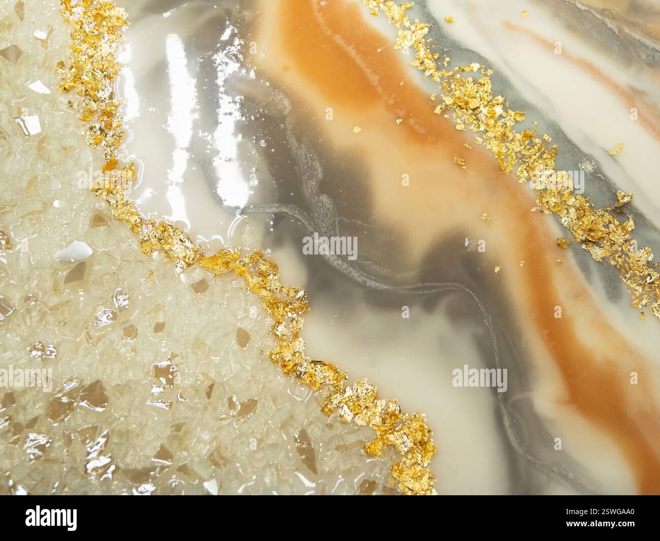 Resin art abstract with golden colors and glass. Epoxy resin art ...