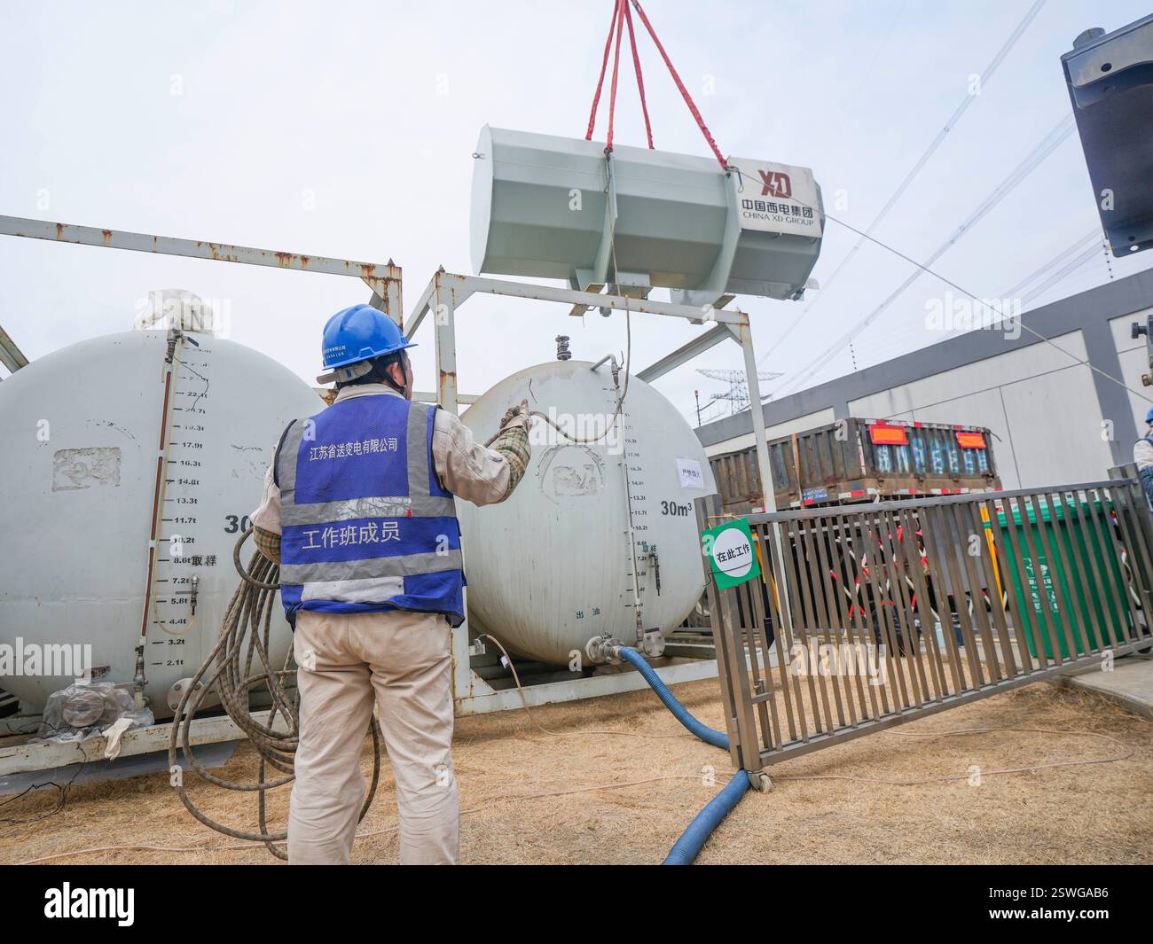 TAIZHOU, CHINA - FEBRUARY 21, 2025 - Construction workers replaced a ...