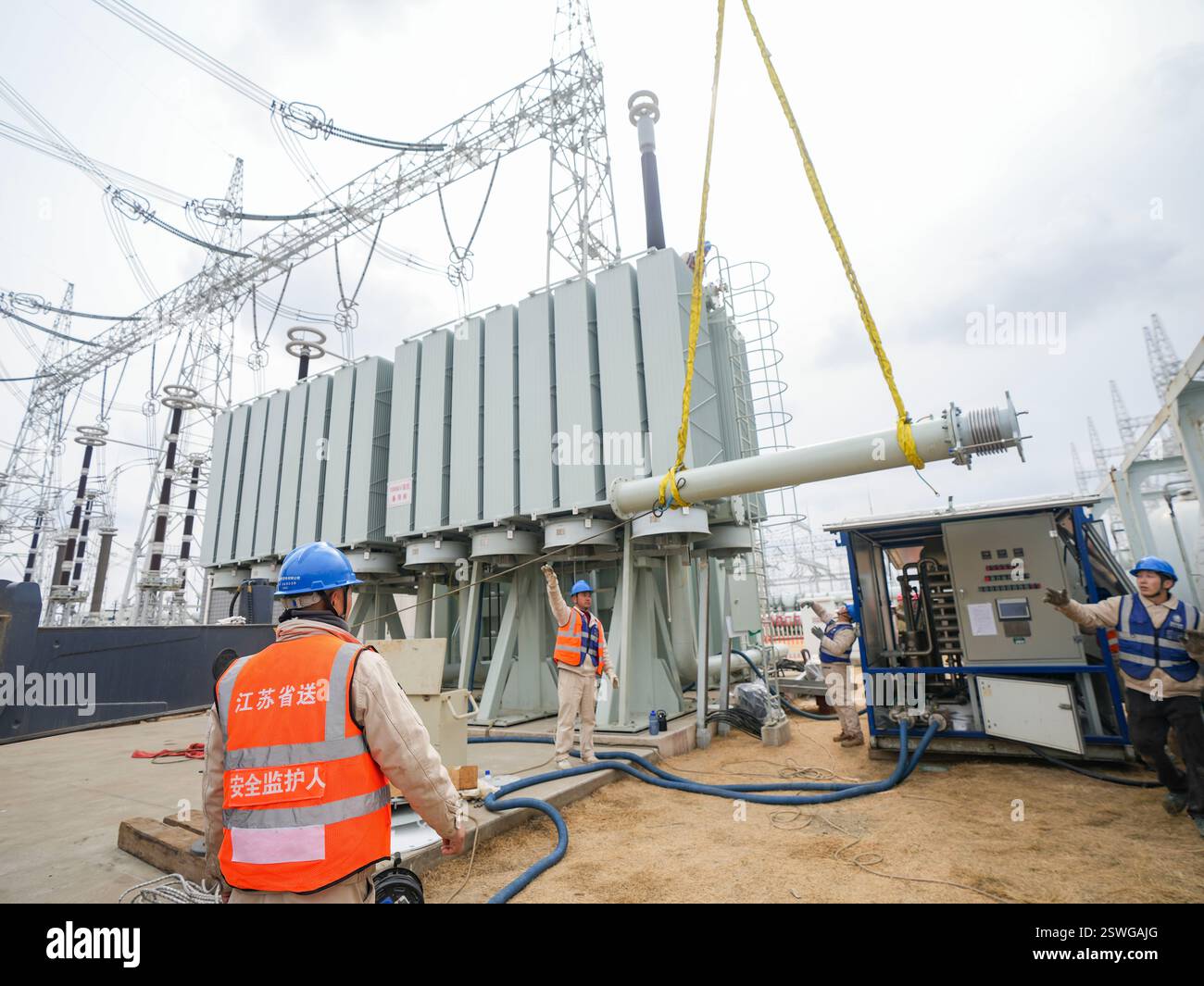 TAIZHOU, CHINA - FEBRUARY 21, 2025 - Construction workers replaced a ...