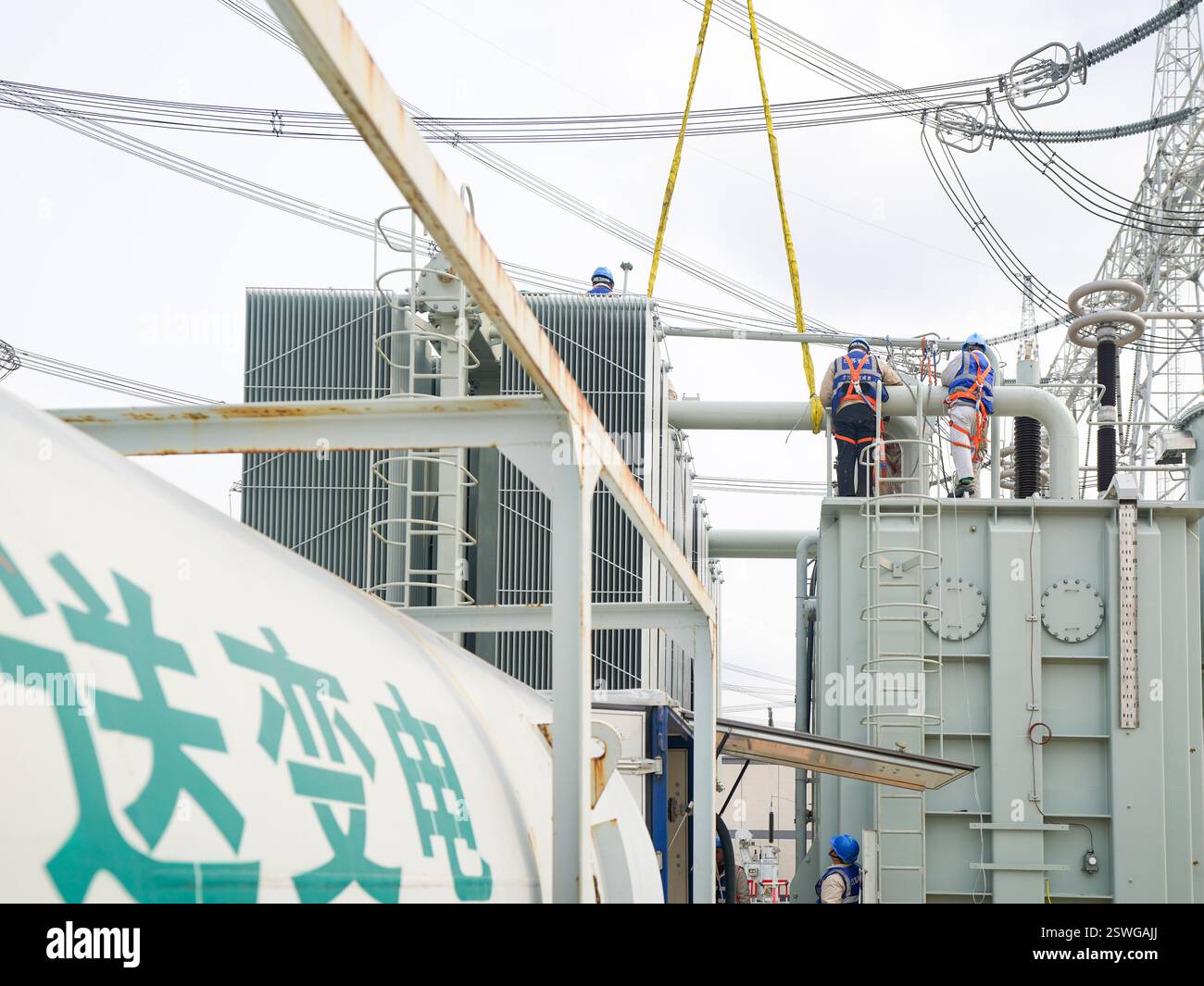 TAIZHOU, CHINA - FEBRUARY 21, 2025 - Construction workers replaced a ...